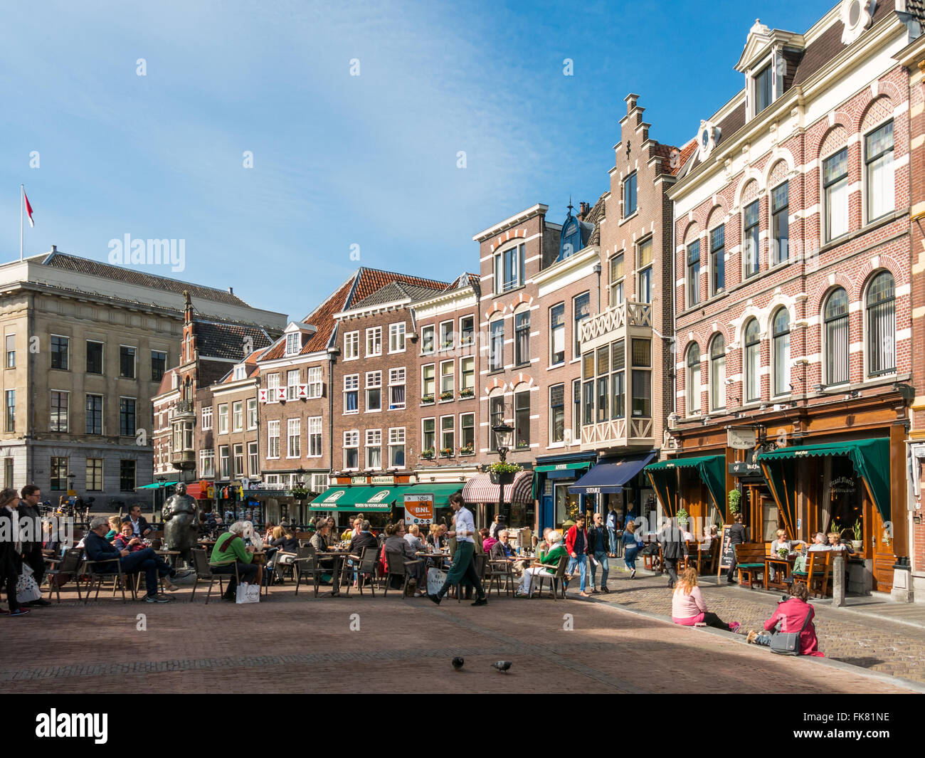 People on outdoor cafe terrace on Vismarkt, Oudegracht canal in the ...