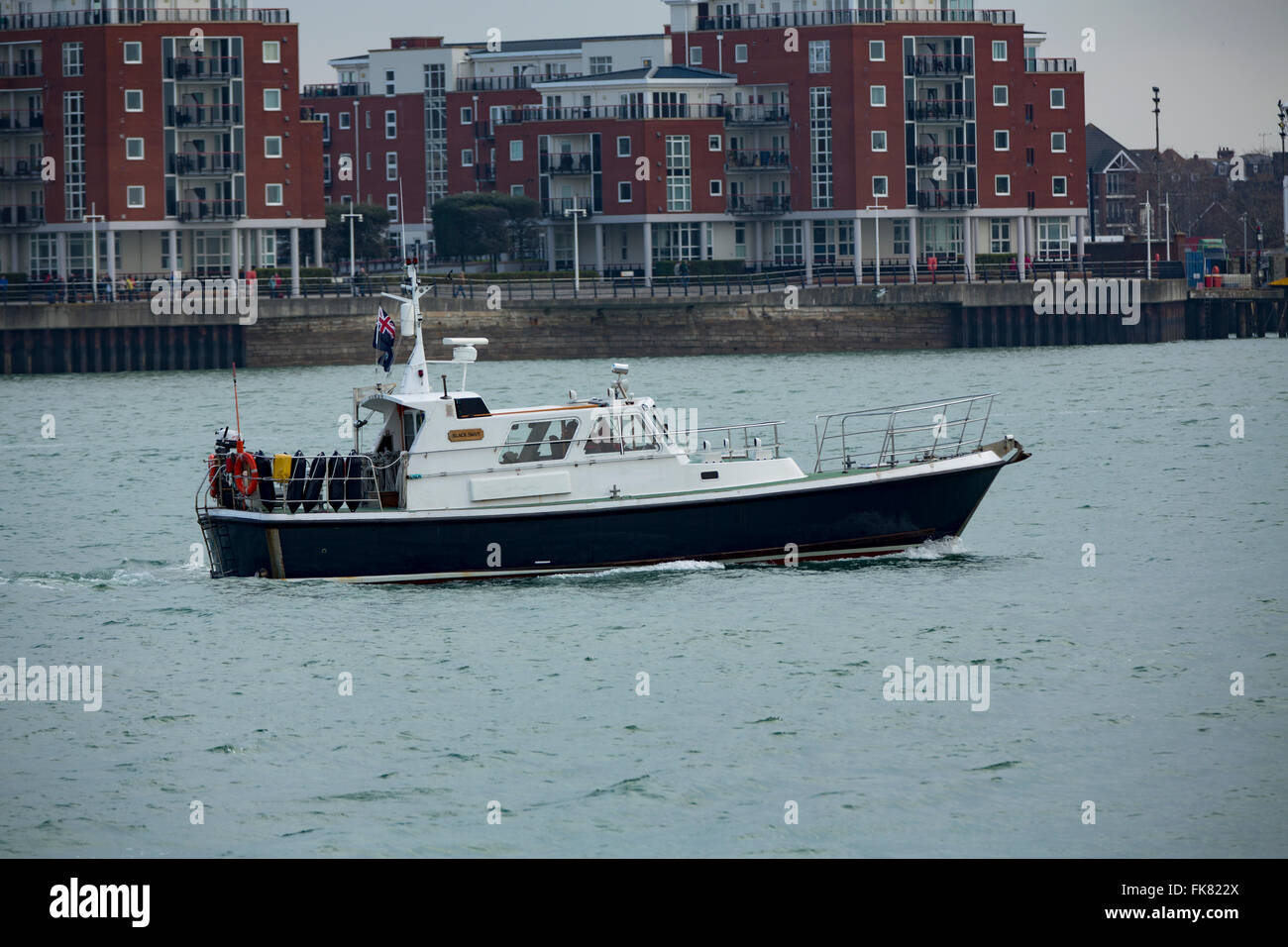 Royal Fleet Auxiliary boat Black Swan passing by Gunwharf Quays ...