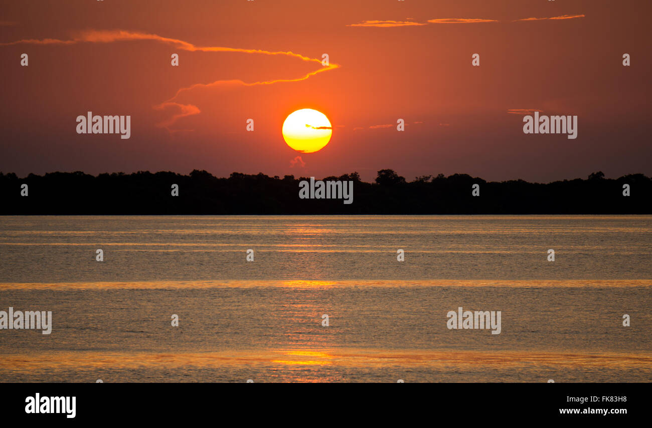 Sunset in Amazon river Stock Photo - Alamy