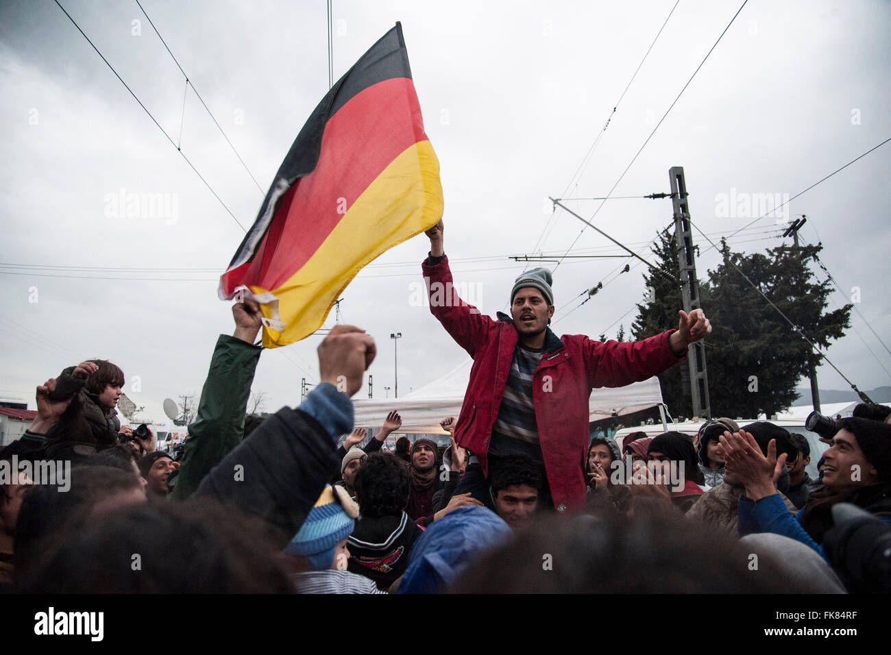 The German flag is shown in a manifestation at the refugee camp of ...