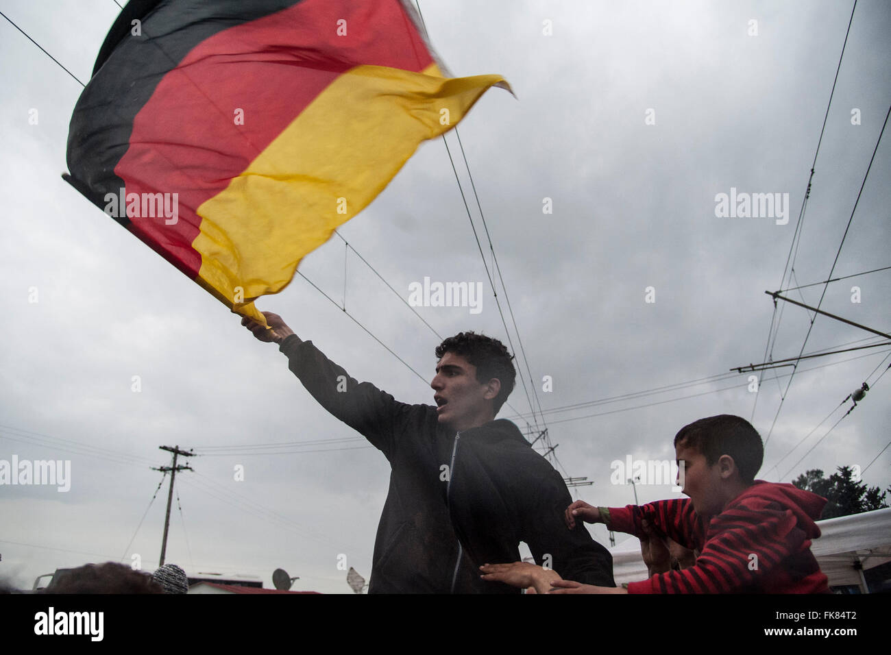 The German flag is shown in a manifestation at the refugee camp of ...