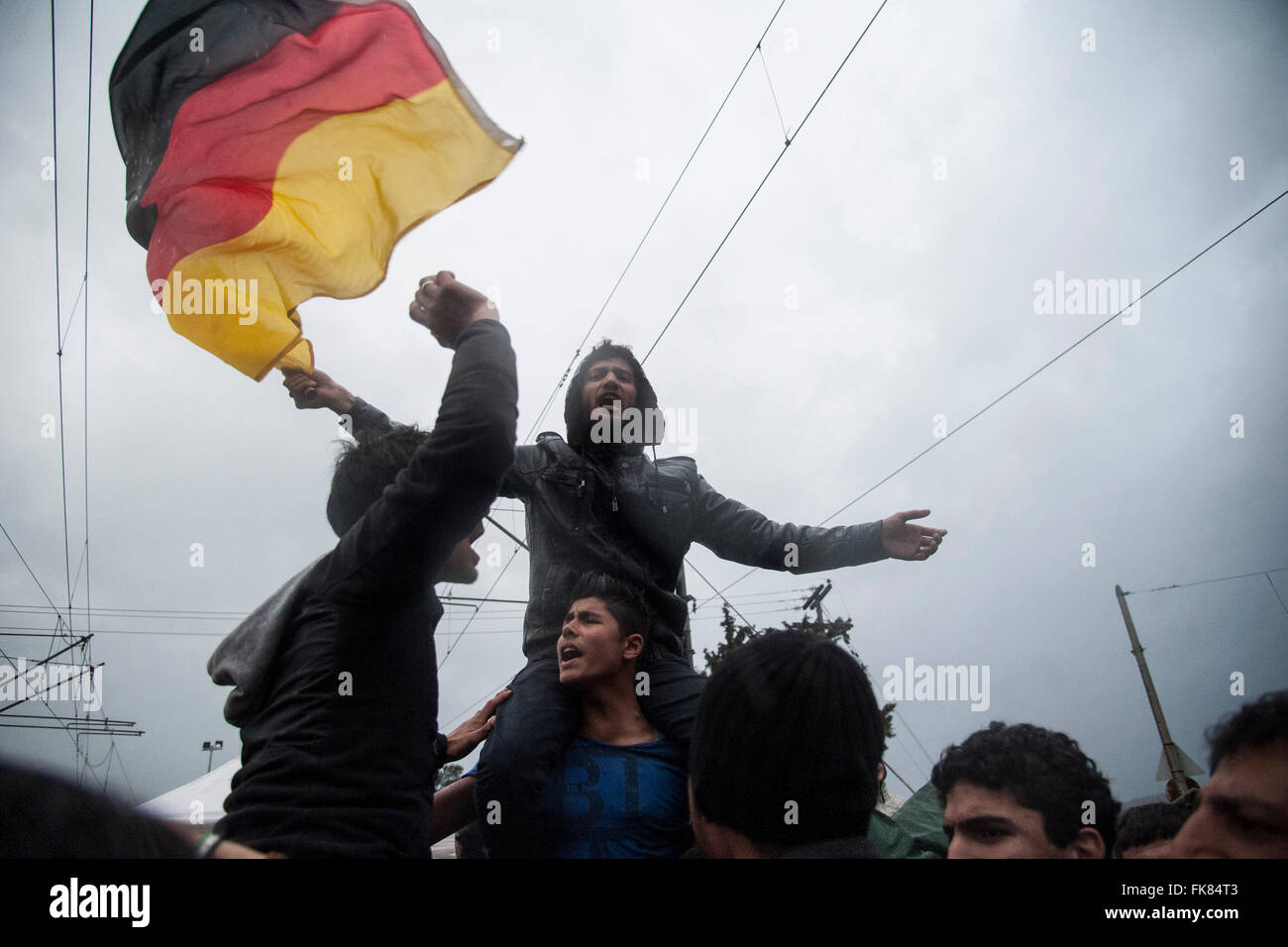 The German flag is shown in a manifestation at the refugee camp of ...
