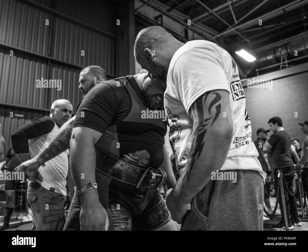 Documentary photography from a power lifting event featuring men ...