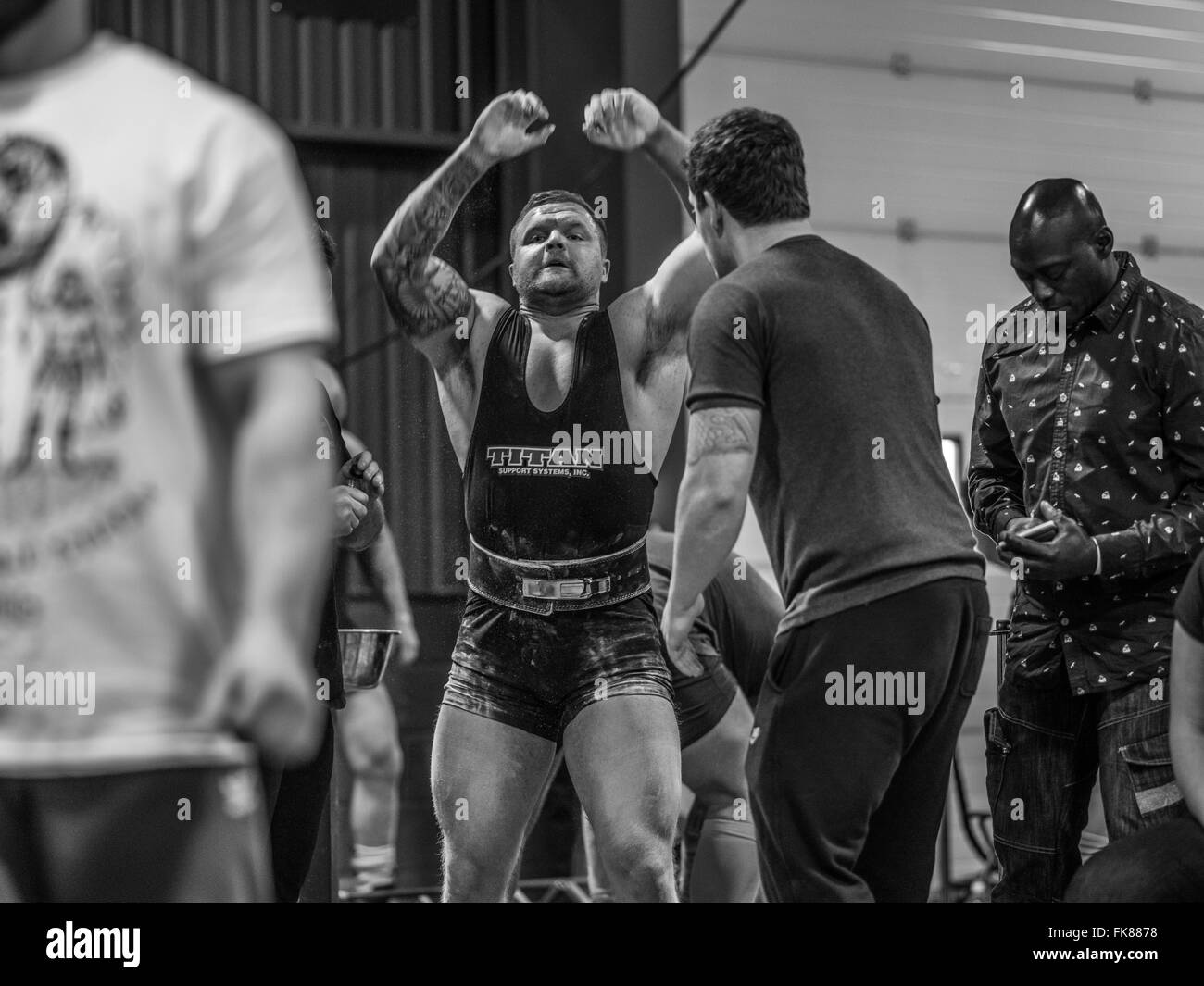 Documentary photography from a power lifting event featuring men ...