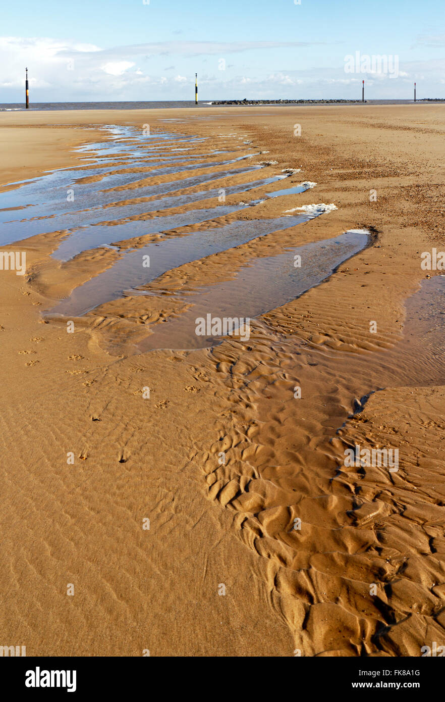 Patterns and pools revealed on a Norfolk beach at low tide caused by ...