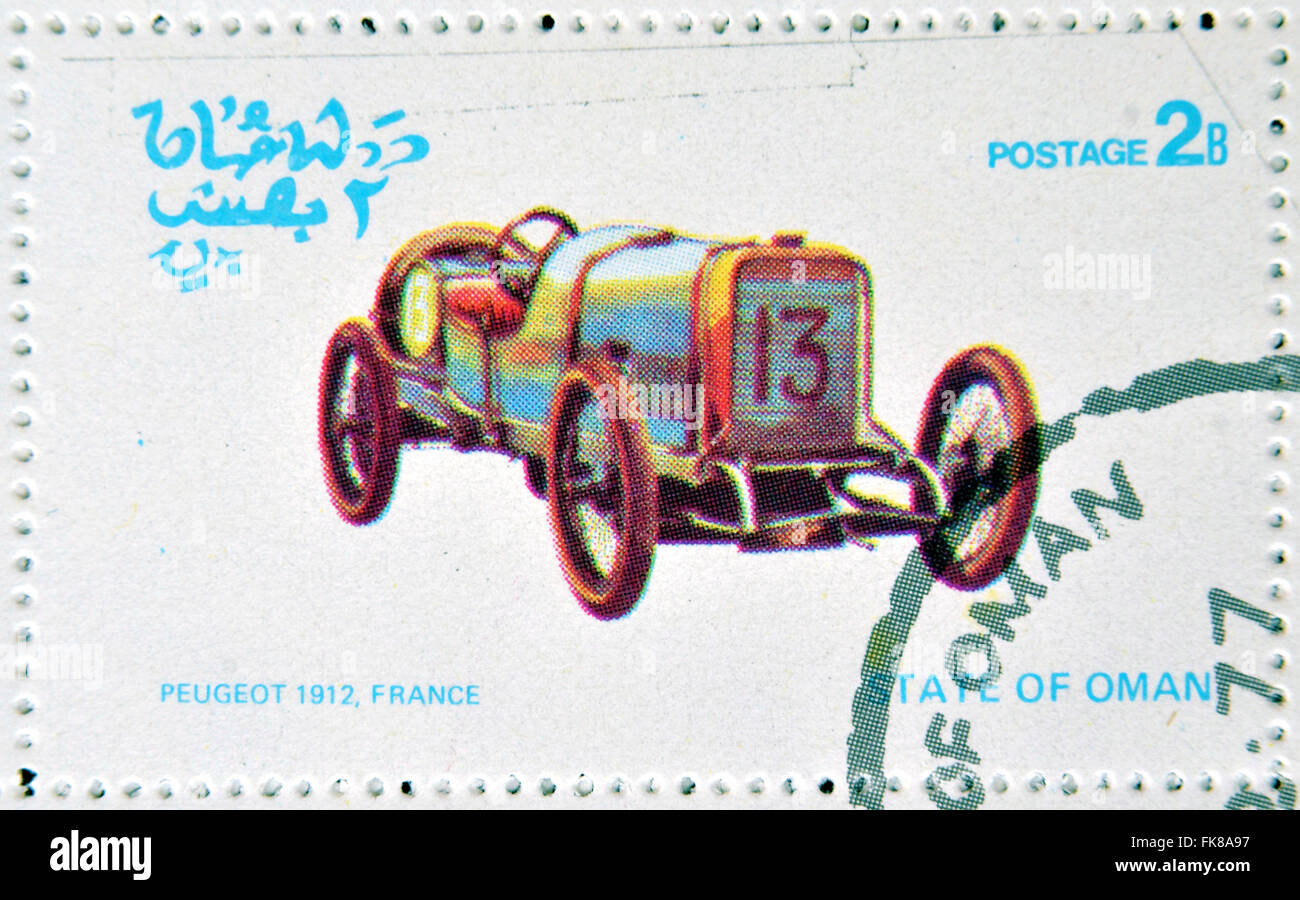 OMAN - CIRCA 1977: A stamp printed in State of Oman shows a old car, Peugeot 1912, France, circa ...