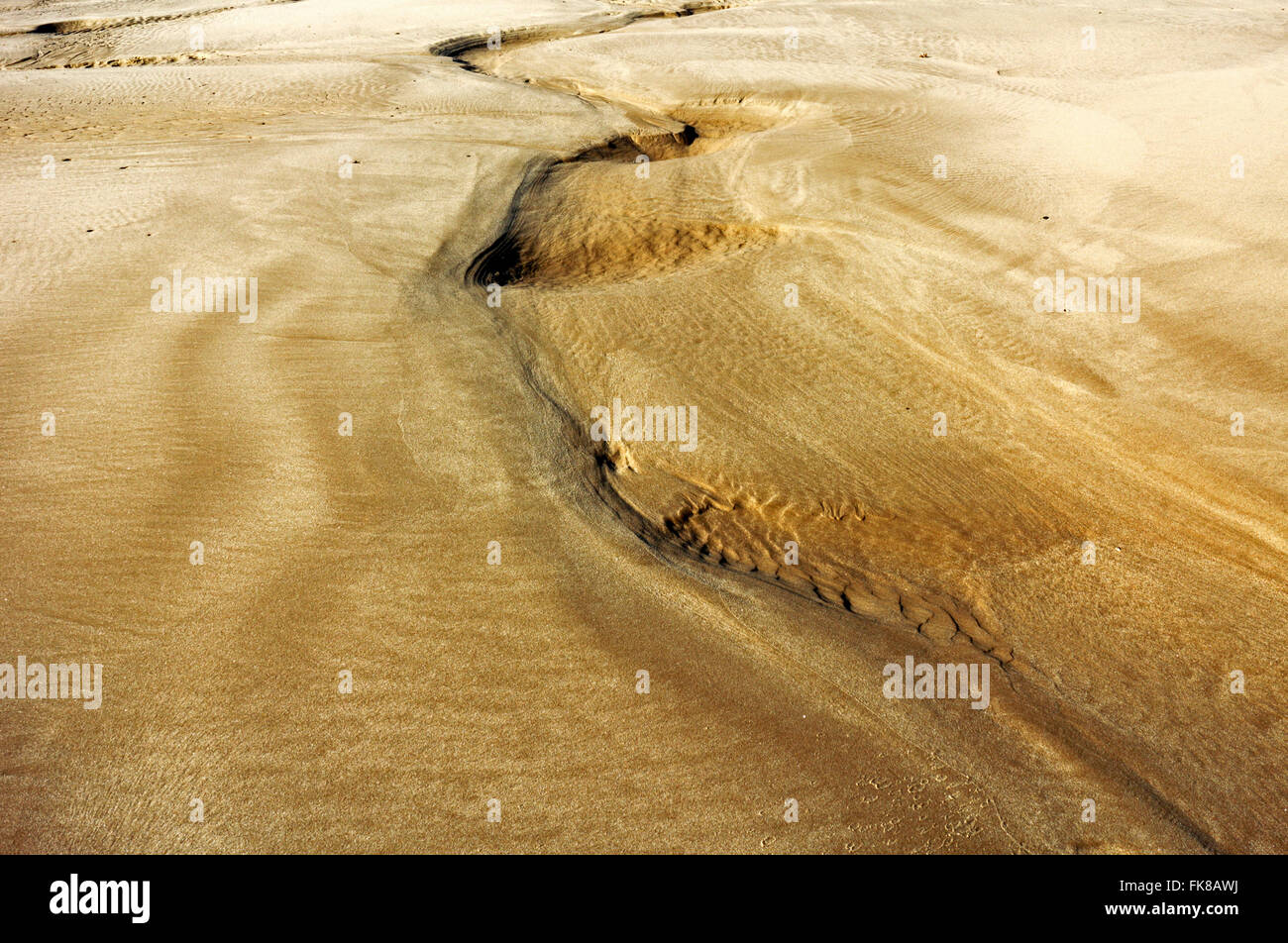 Patterns in the sand caused by tides and currents on a Norfolk Beach ...