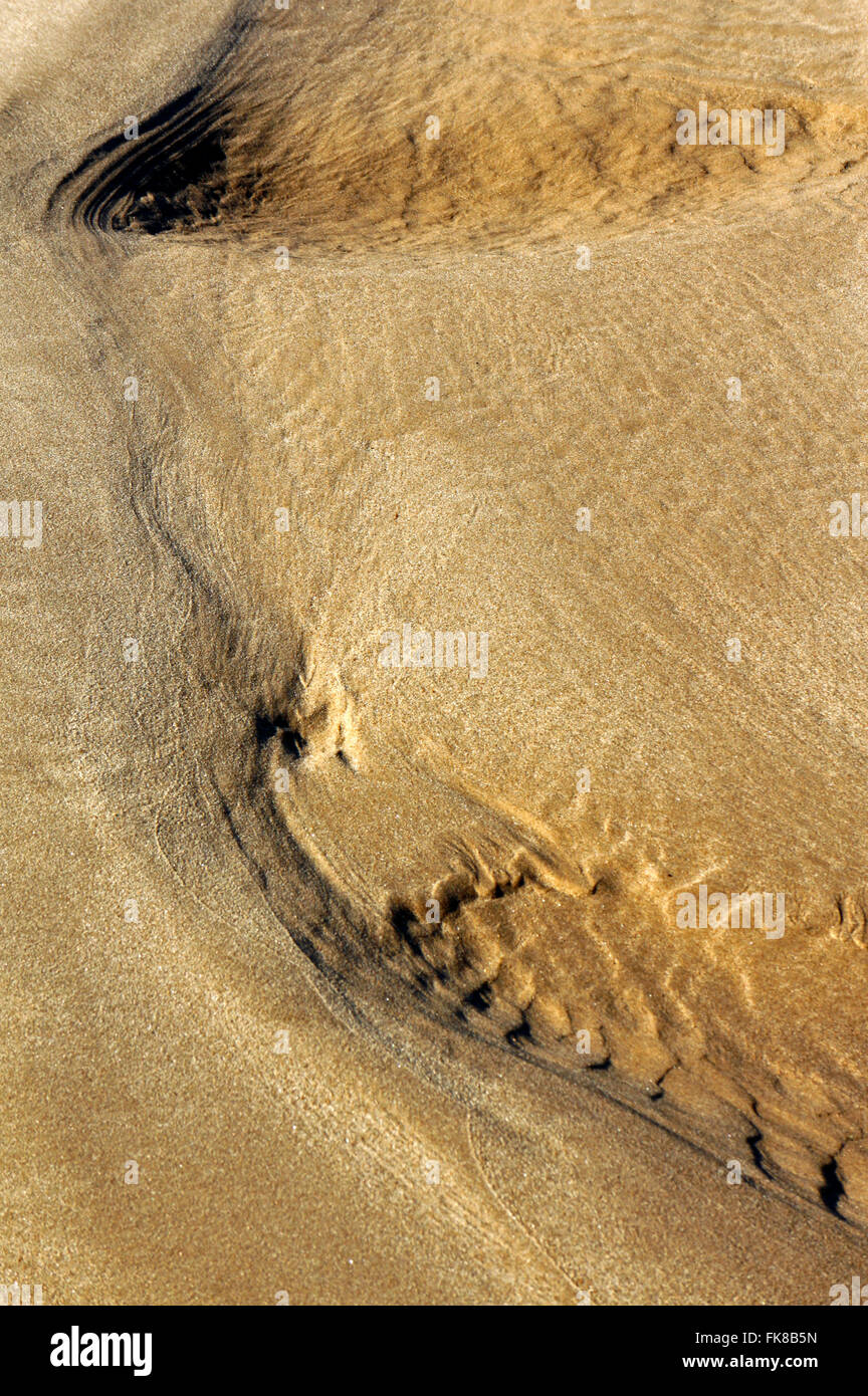 Patterns in the sand caused by tides and currents on a Norfolk beach ...