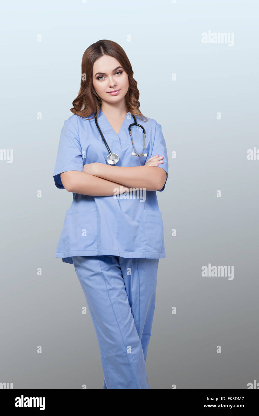 Caucasian doctor in blue uniform, doctor holding documents, friendly ...