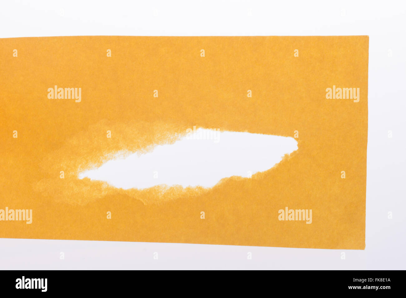 Torn Yellow Paper on a white background Stock Photo - Alamy