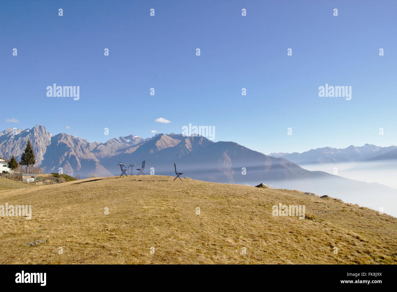 Inversion at Como Lake, stairs and table above a sea of clouds, Italy ...