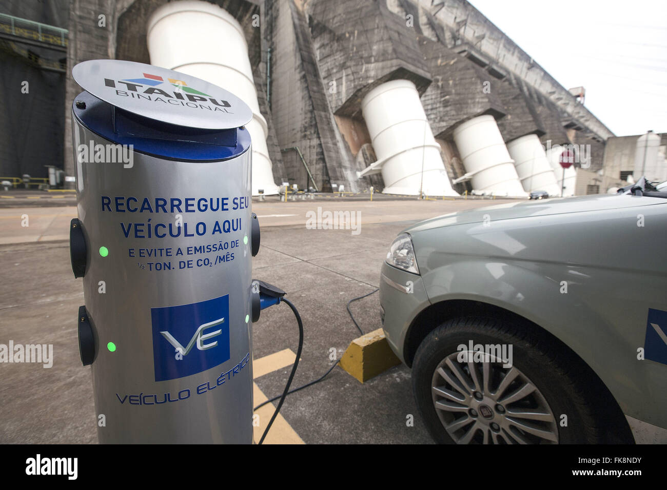 Electric vehicle being fueled at Itaipu Hydroelectric Power Plant Stock ...