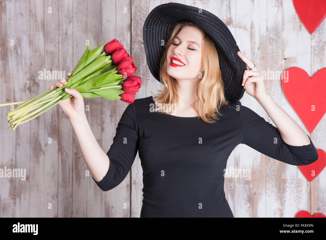 happy girl with red spring flowers, emotions, joy, love. horizontal ...