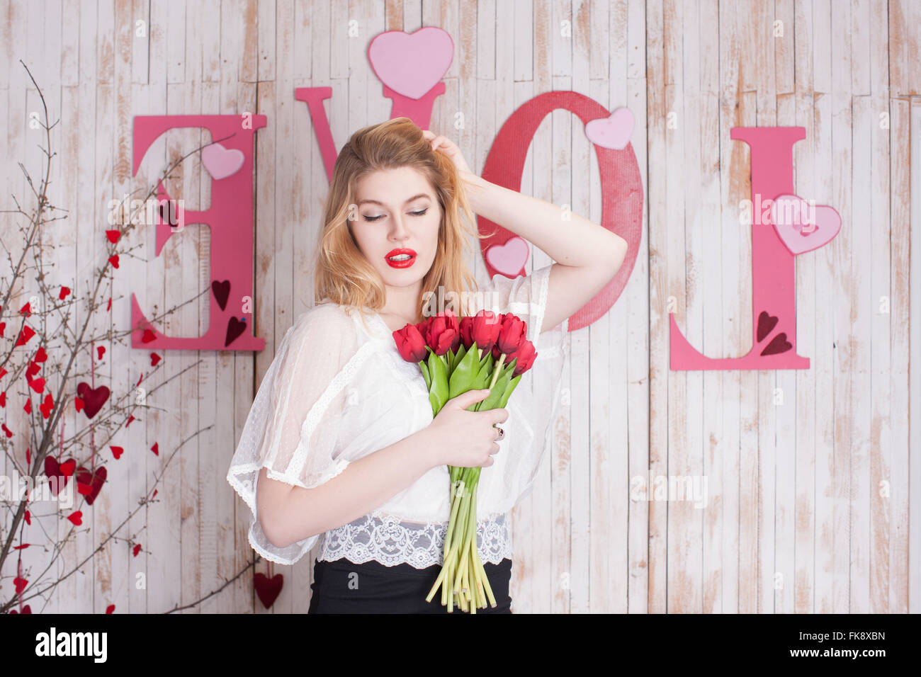 happy girl with red spring flowers, emotions, joy, love. horizontal ...