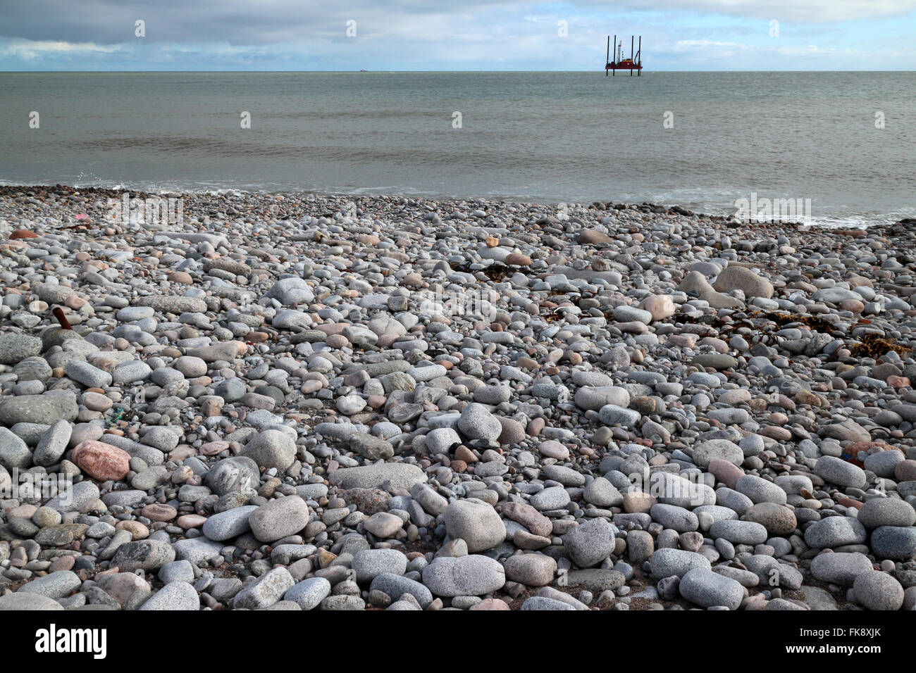 Nigg bay - Pebbles beach and rig in the distance - Aberdeen city ...