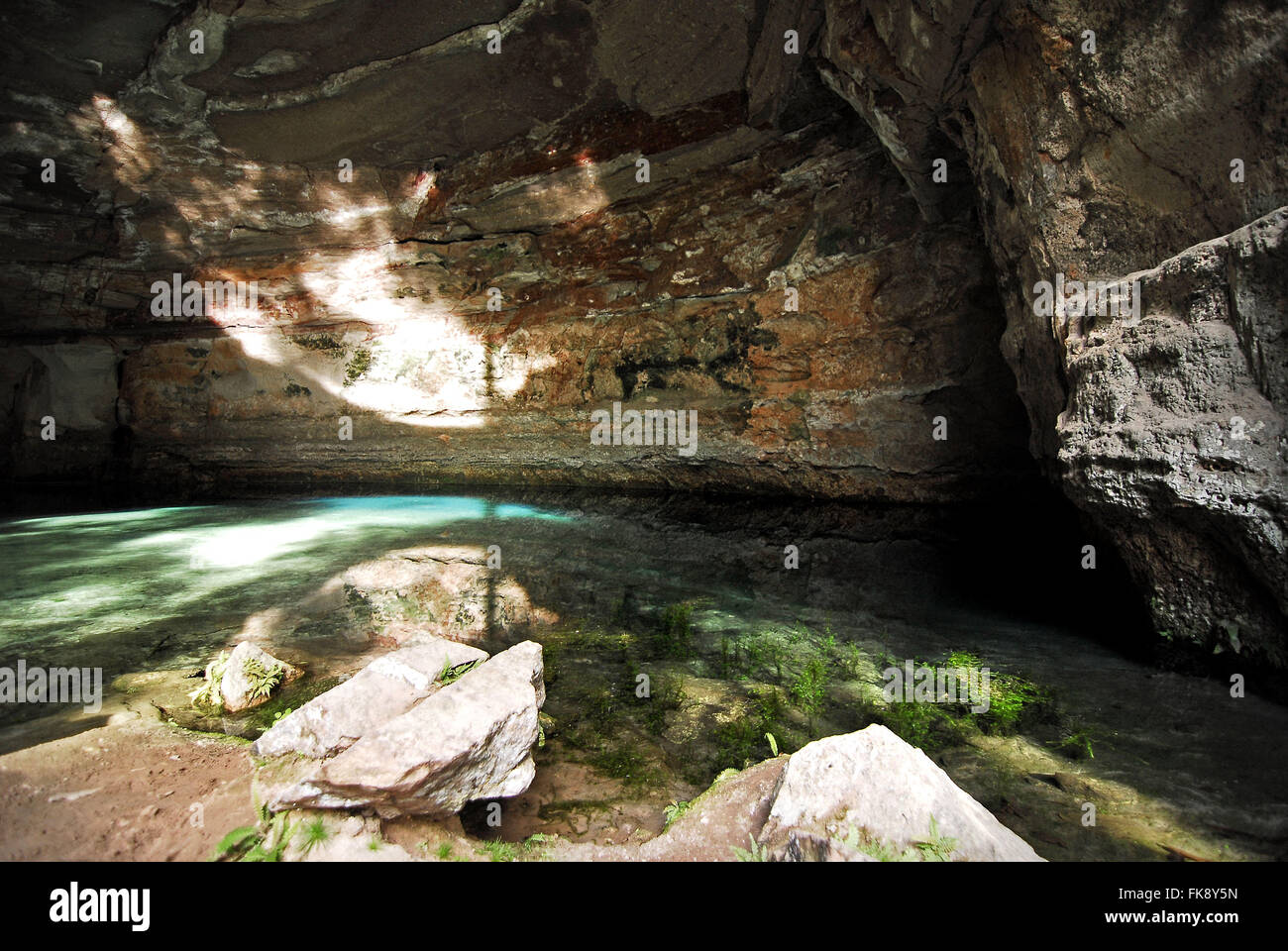 Grotto flooded sandstone and enlightened by the light of the afternoon ...