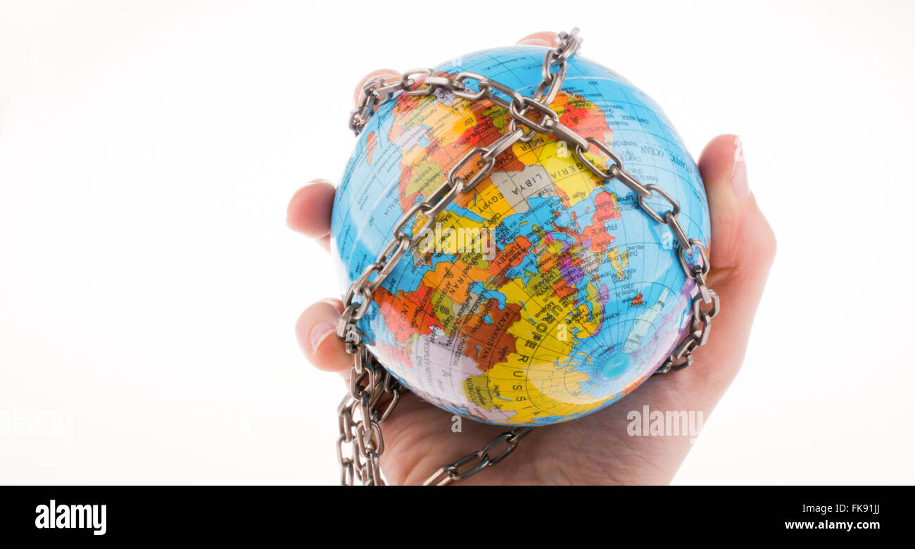 Globe in chain on a white background Stock Photo - Alamy