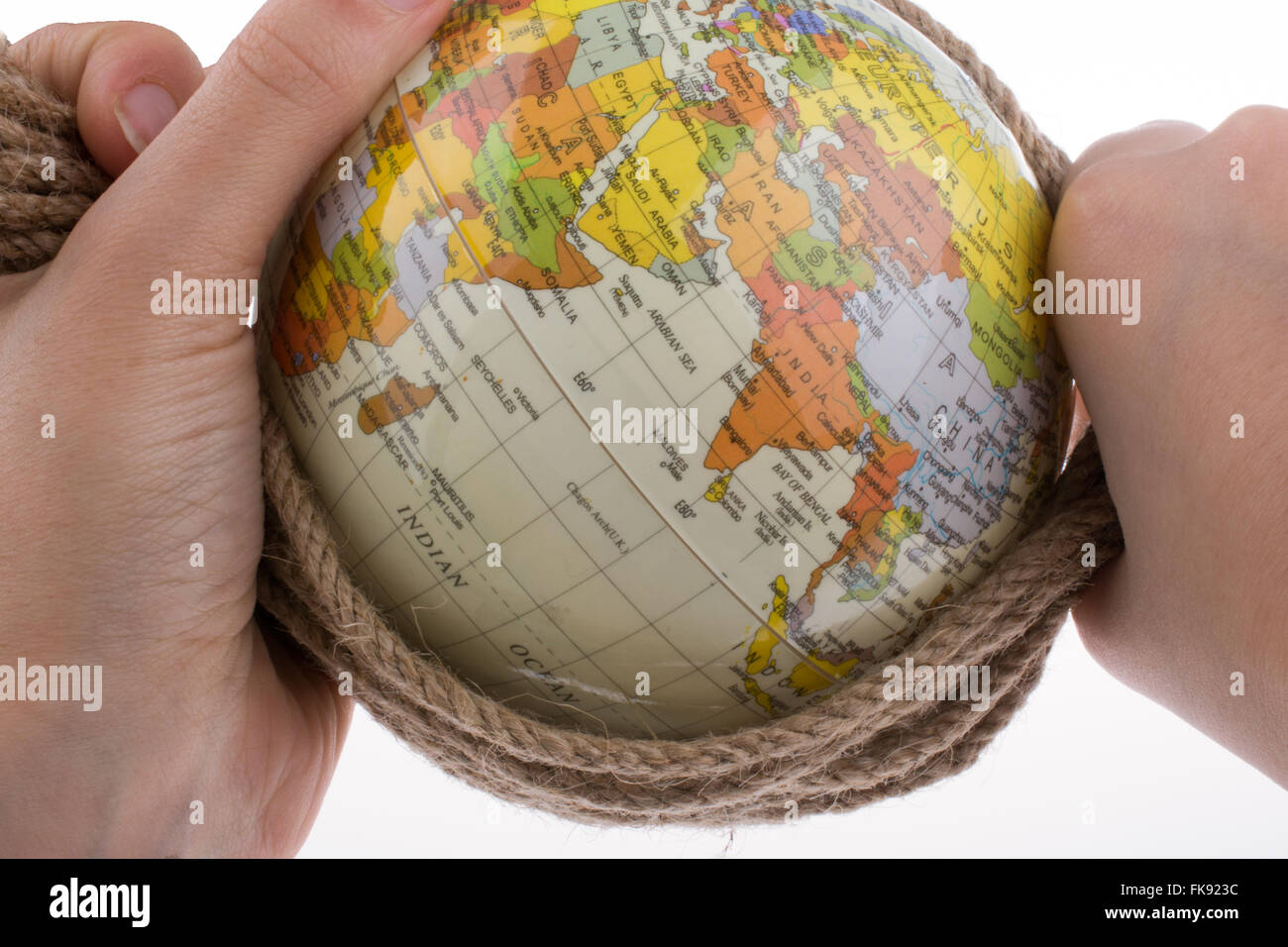 hands holding the globe wrapped in rope Stock Photo - Alamy