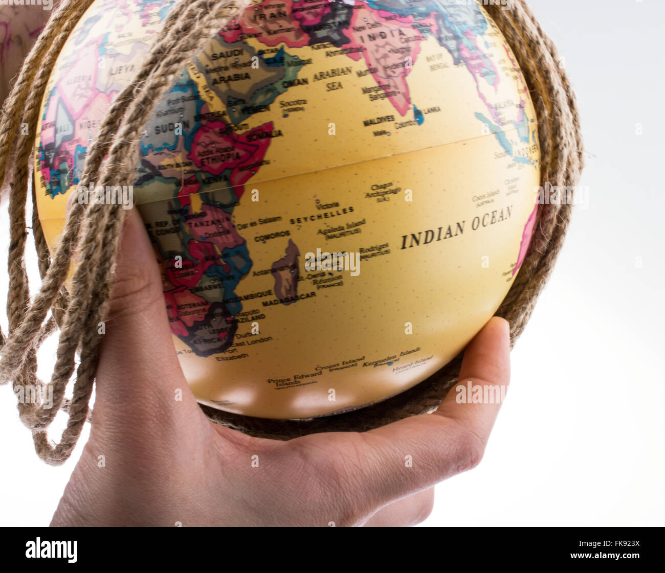 hands holding the globe wrapped in rope Stock Photo - Alamy
