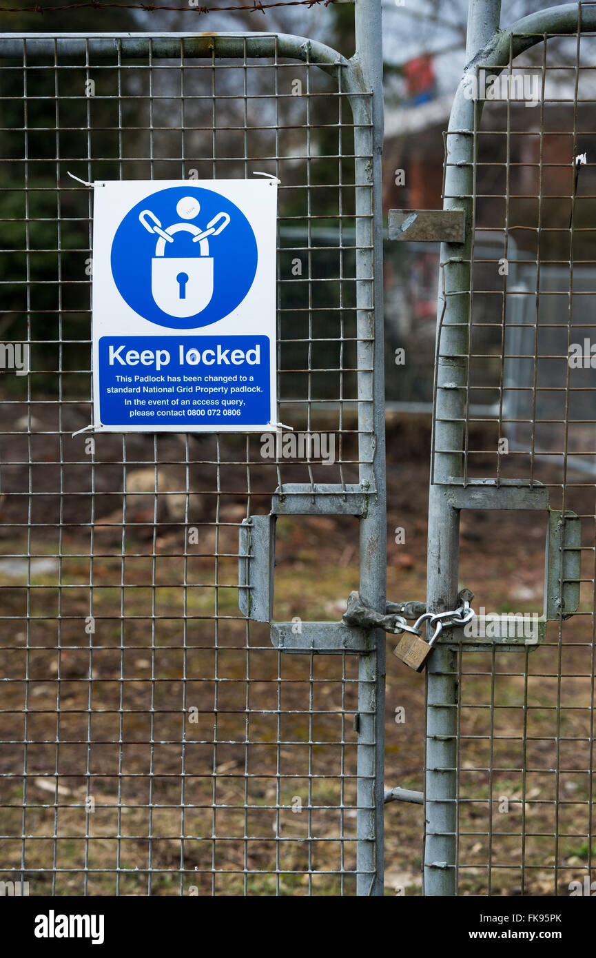 Health and Safety keep locked sign on perimeter fence of a construction ...