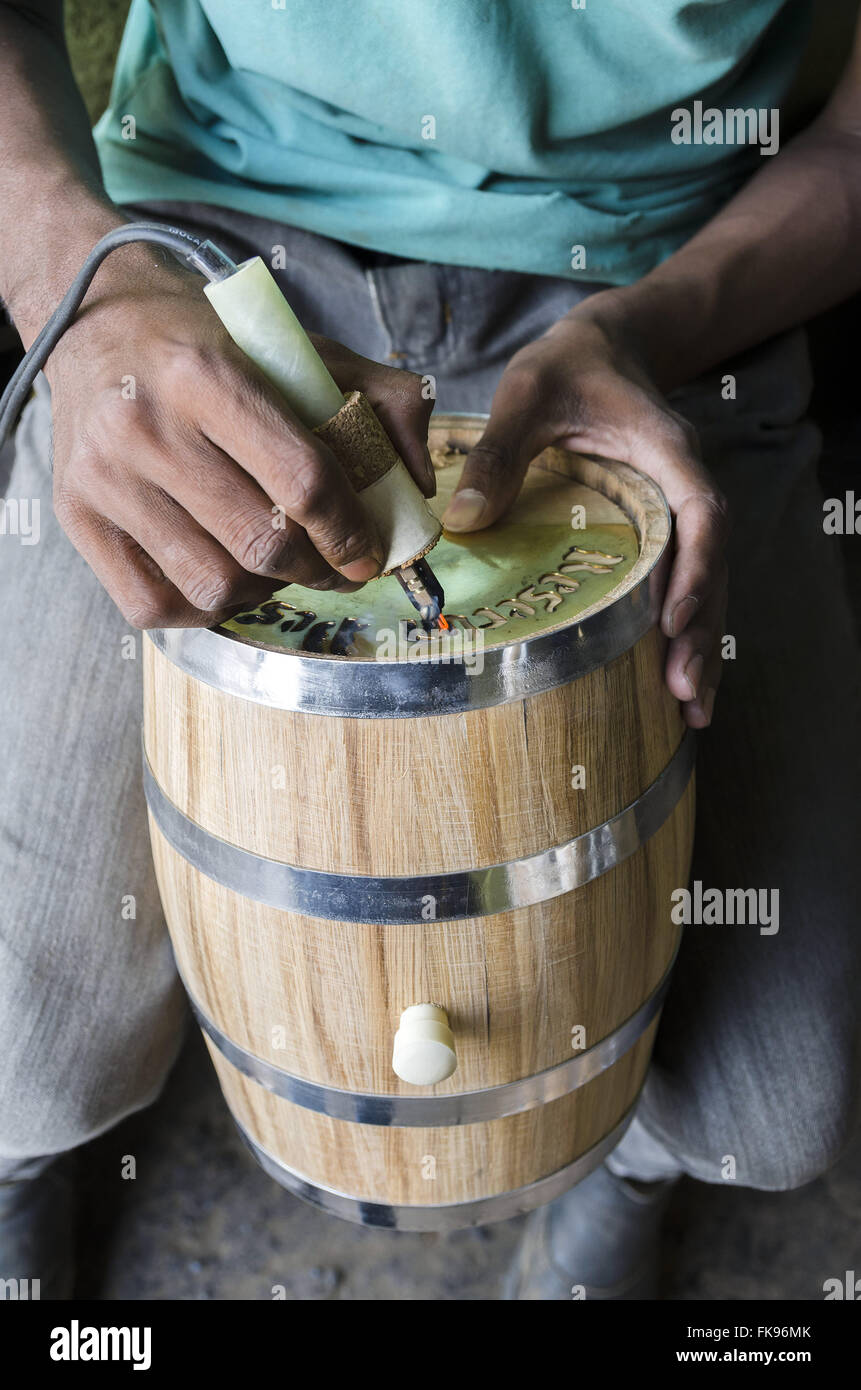 Manufactures wooden barrels for cachaca storage - the company`s brand ...