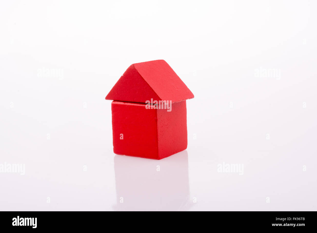House made of red color blocks on a white background Stock Photo - Alamy