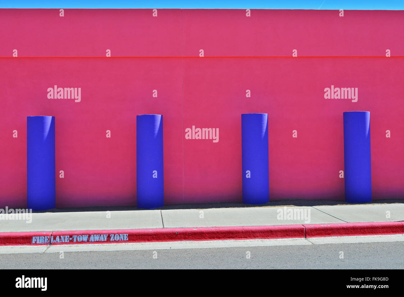 Colored concrete poles and contrasting colored walls Stock Photo - Alamy
