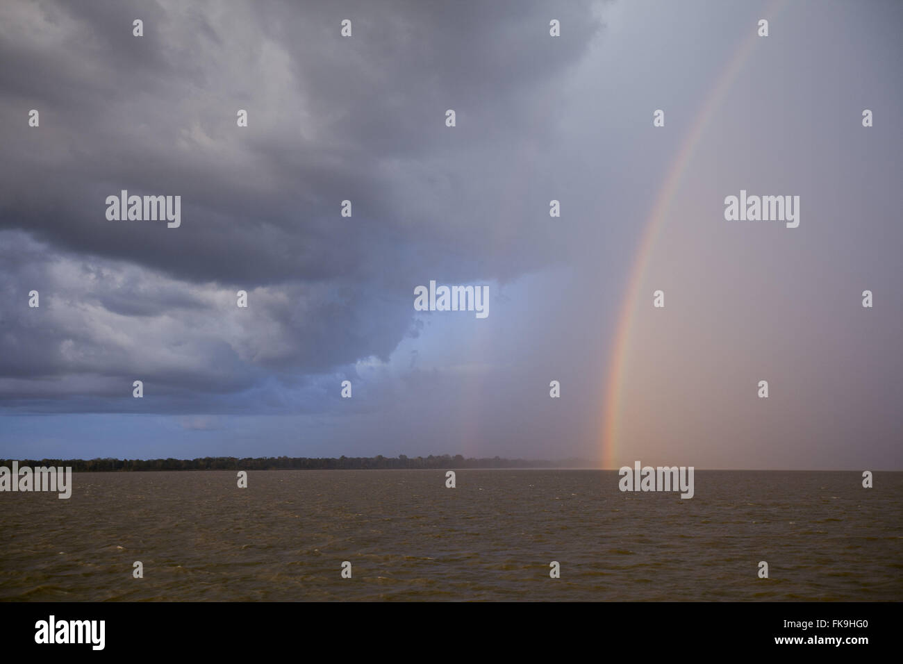 Tropical rain and bow in the region of Alto Solimoes Stock Photo - Alamy
