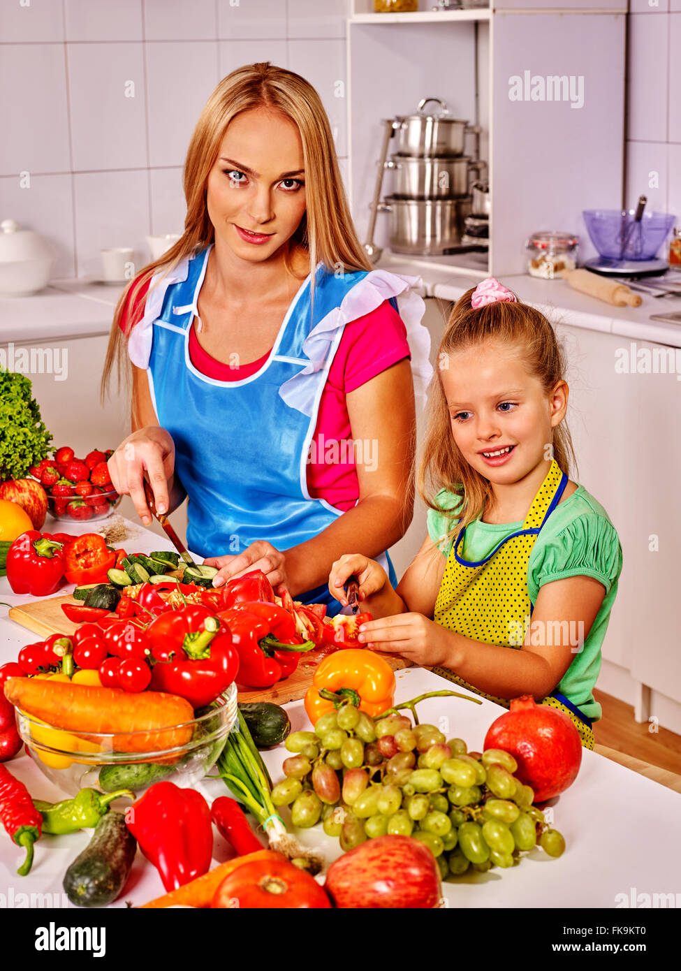 Mother and child cooking at kitchen Stock Photo - Alamy