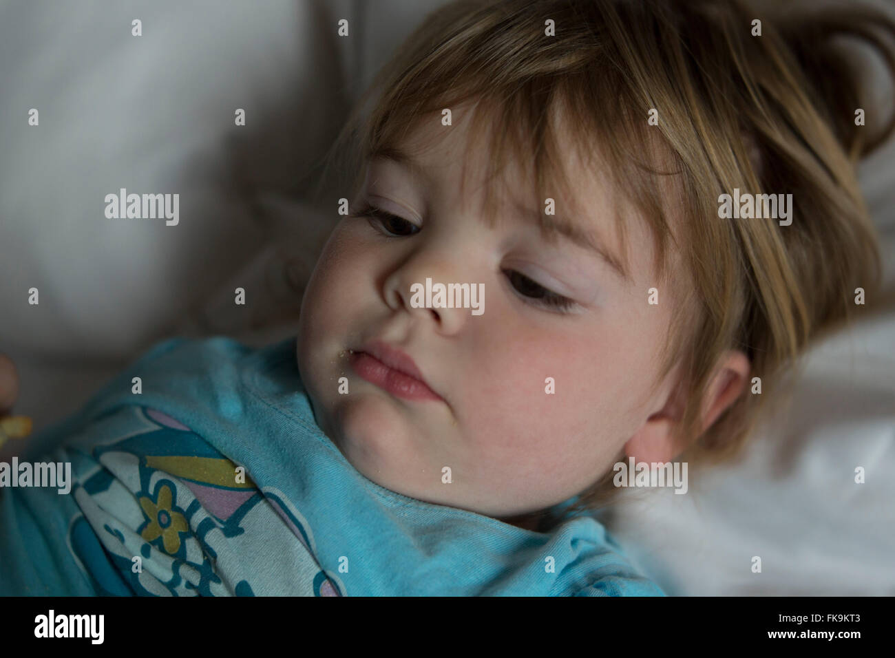 Girl in bed, not feeling well Stock Photo - Alamy