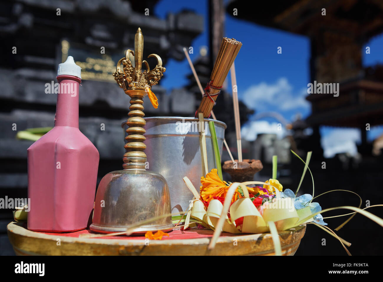 Ritual priest bell, holy water and canang sari - traditional offering ...