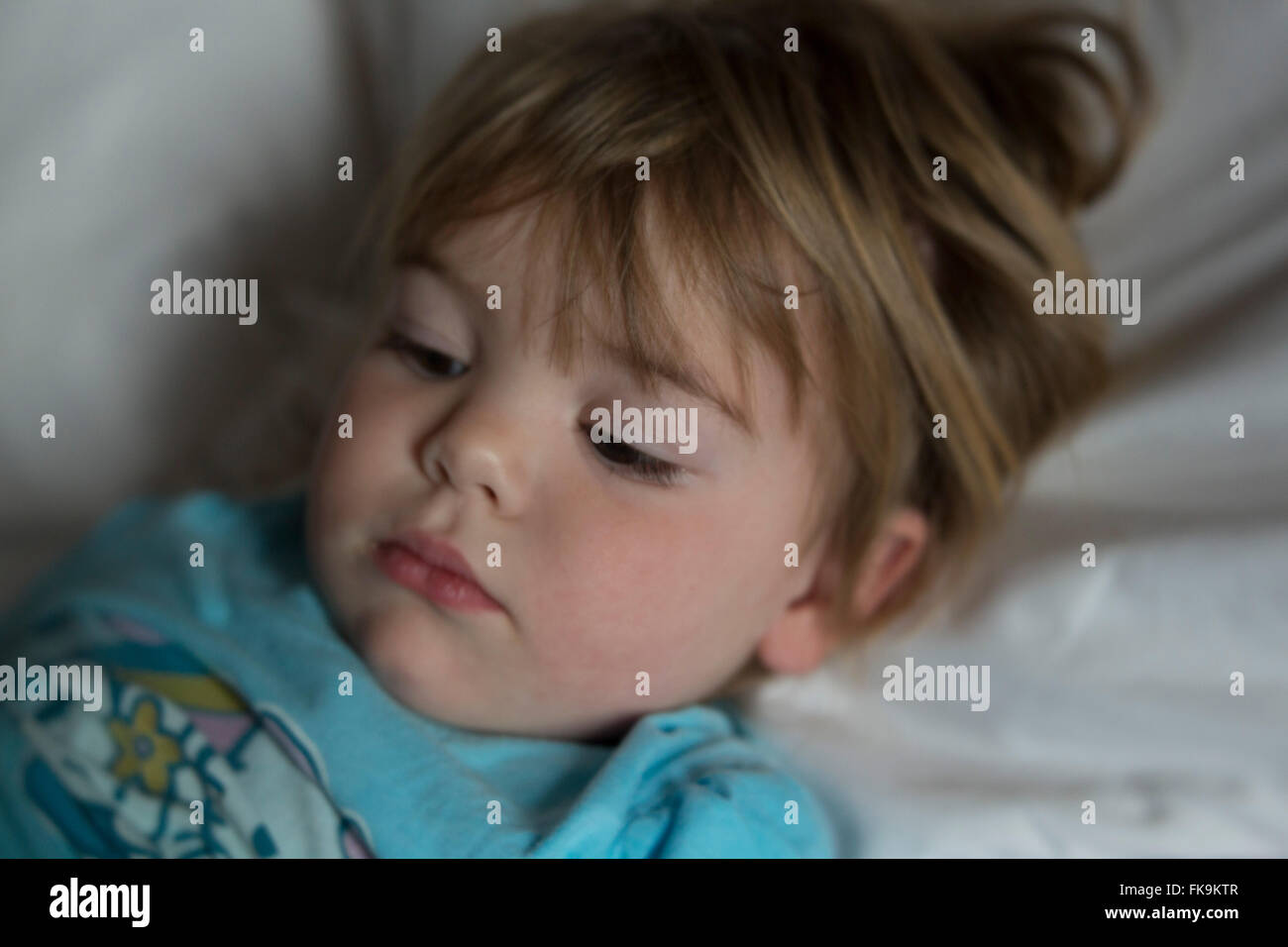 Girl in bed, not feeling well Stock Photo - Alamy