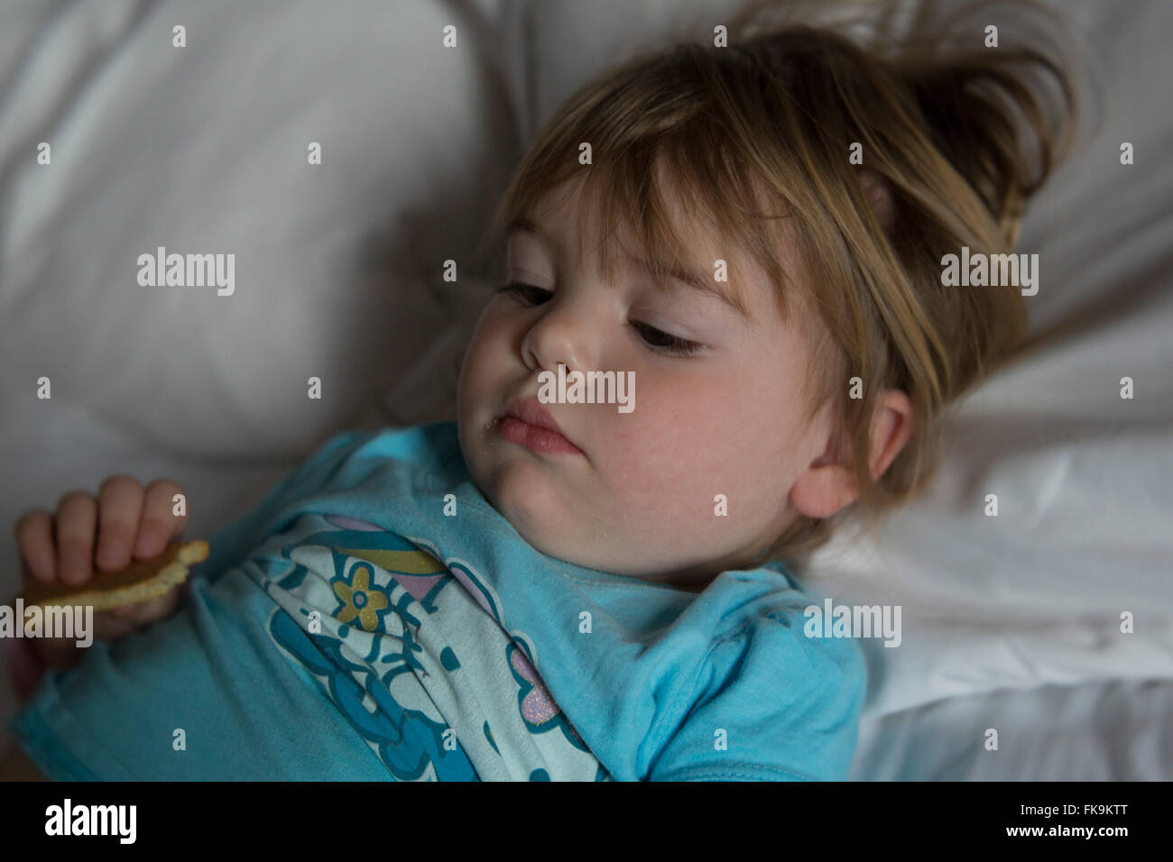 Girl in bed, not feeling well Stock Photo - Alamy