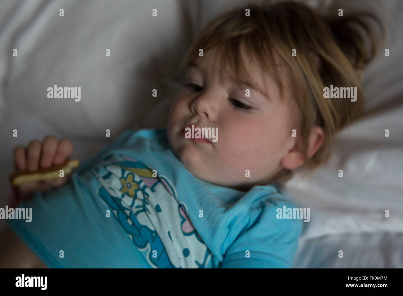 Girl in bed, not feeling well Stock Photo - Alamy