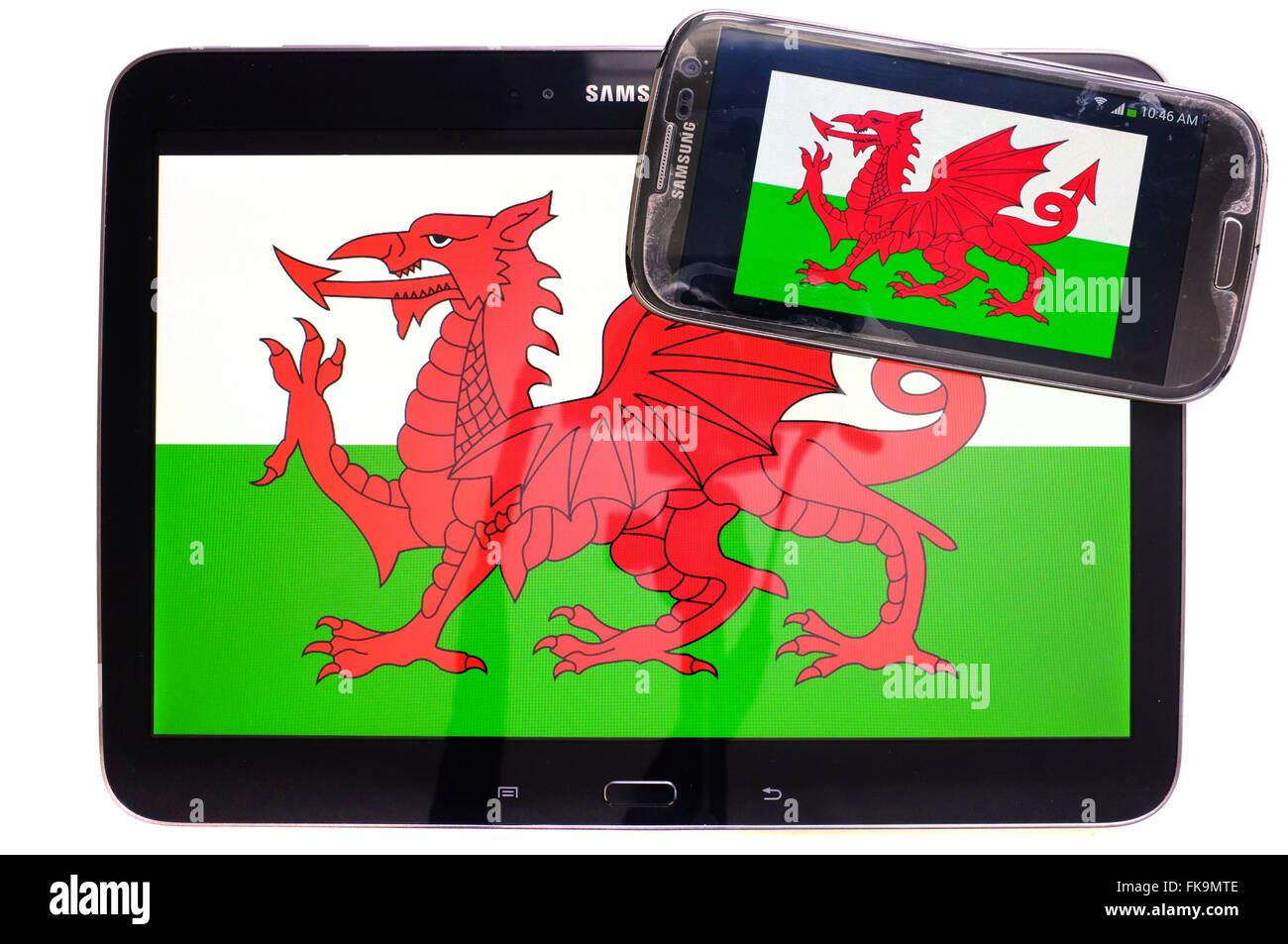 A tablet and a smartphone with the Welsh flag on them photographed ...