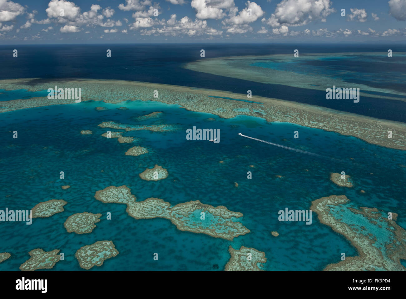 Aerial view of Hardy Reef with float plane, home to the heart reef, in ...