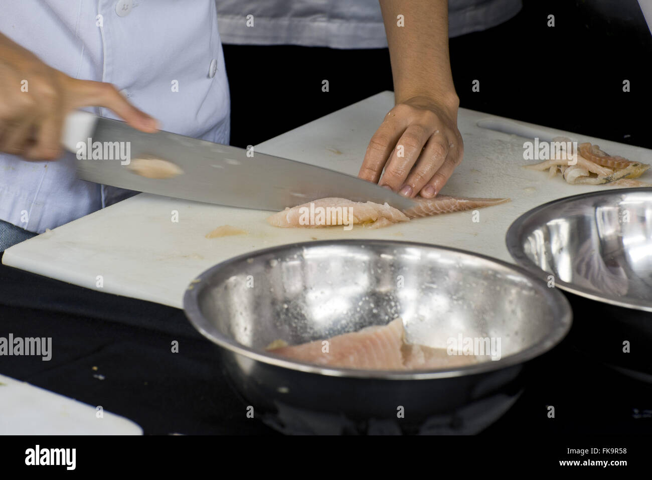 Chef cutting hake or for preparation of ceviche ceviche - typical ...