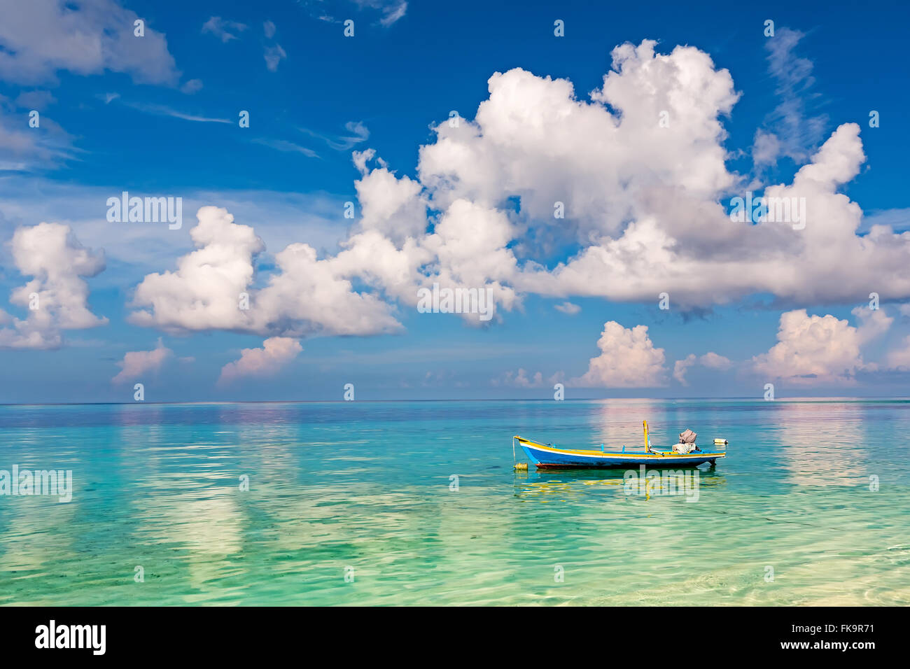 Beautiful ocean beach and boat Stock Photo - Alamy