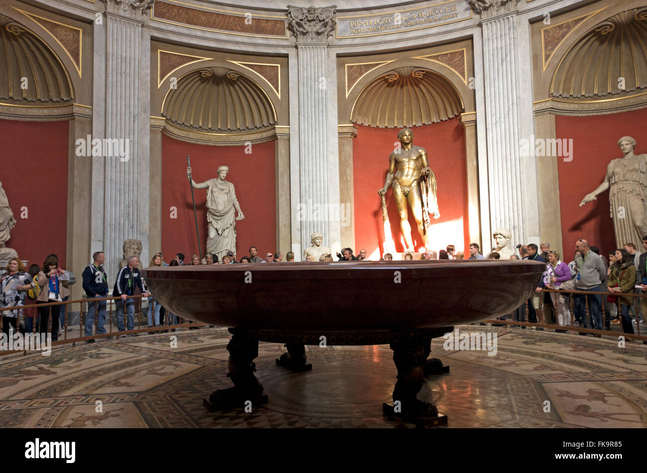 Round Room in Vatican Museum, with statues in the niches, large red ...