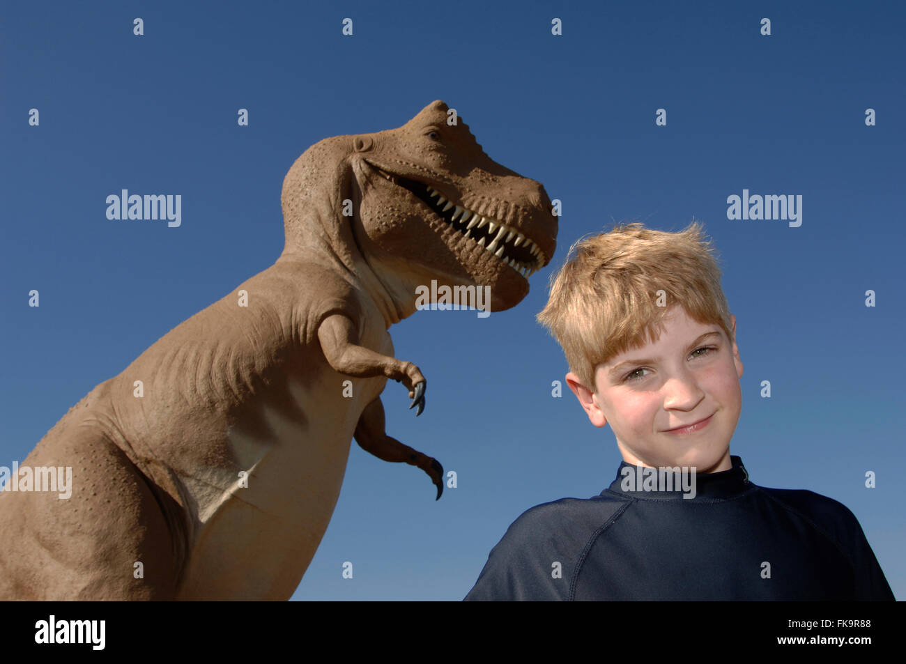 Young Boy and Dinosaur Stock Photo - Alamy