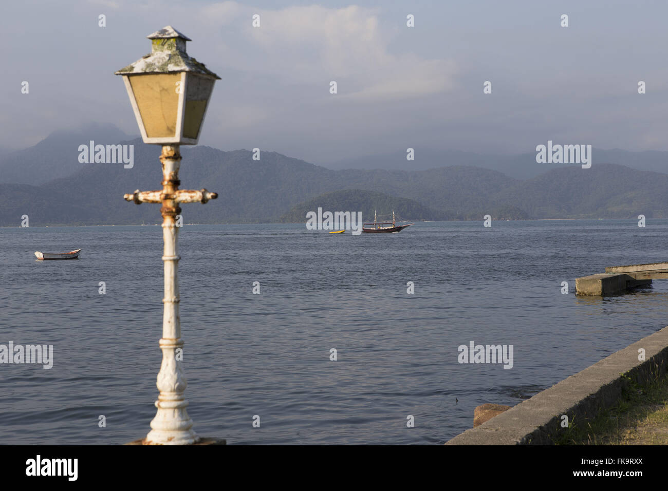 Old lamp post on the waterfront of the Itagu· Beach Stock Photo - Alamy