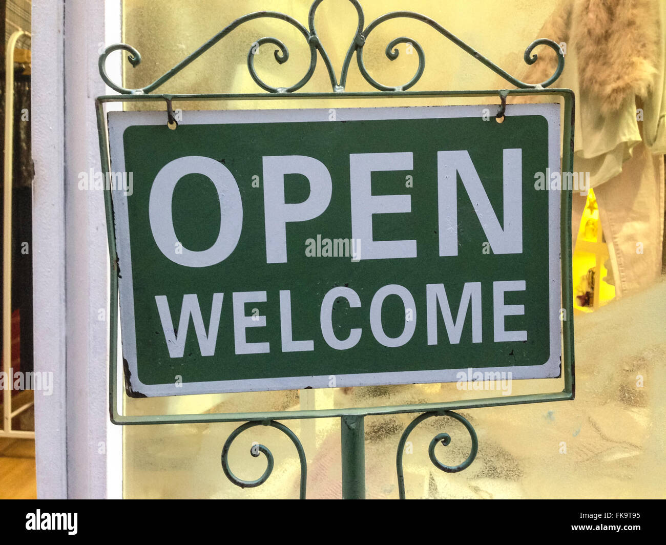 Vintage open stand alone sign outside a fashion shop Stock Photo - Alamy