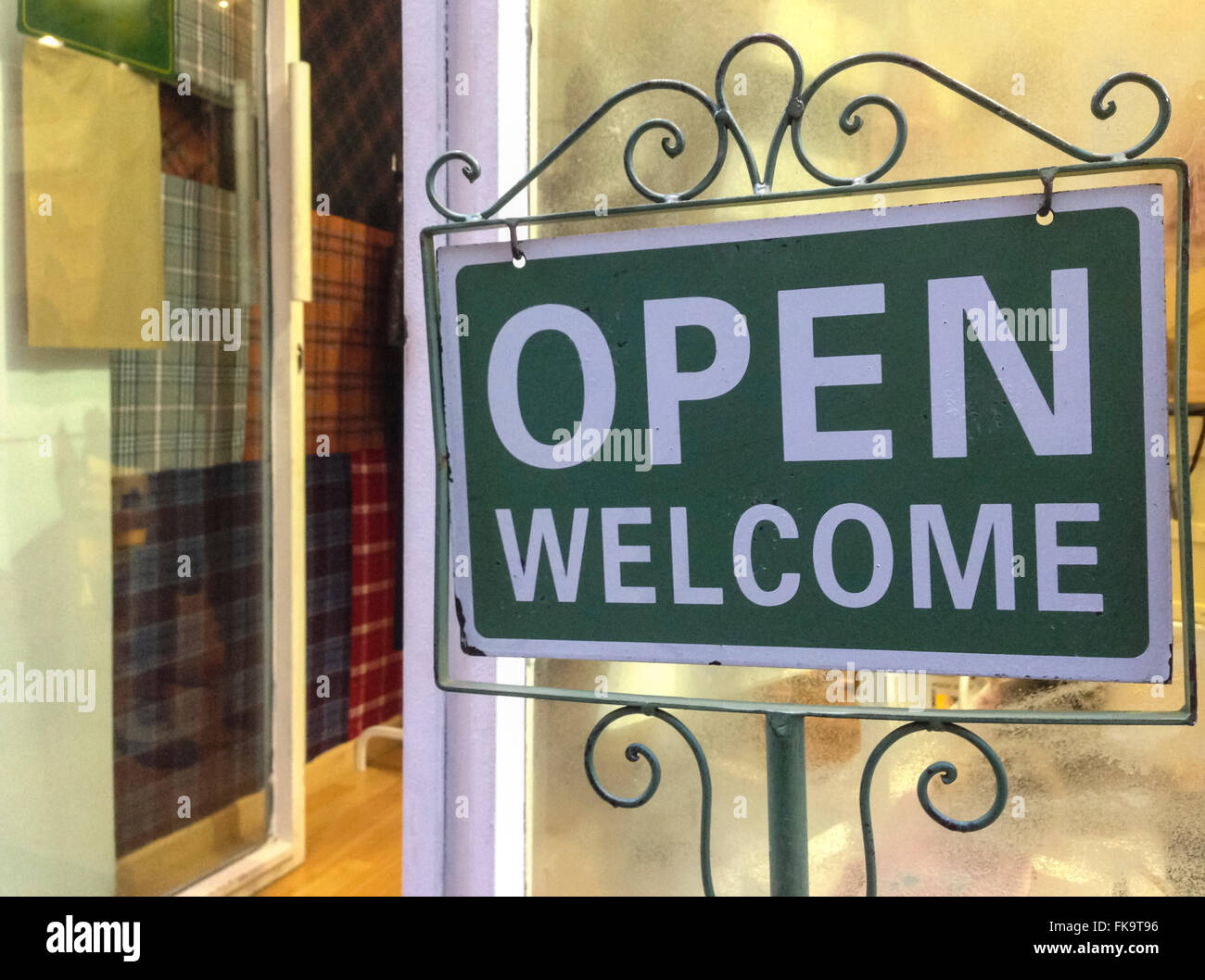 Vintage open stand alone sign outside a fashion shop Stock Photo - Alamy