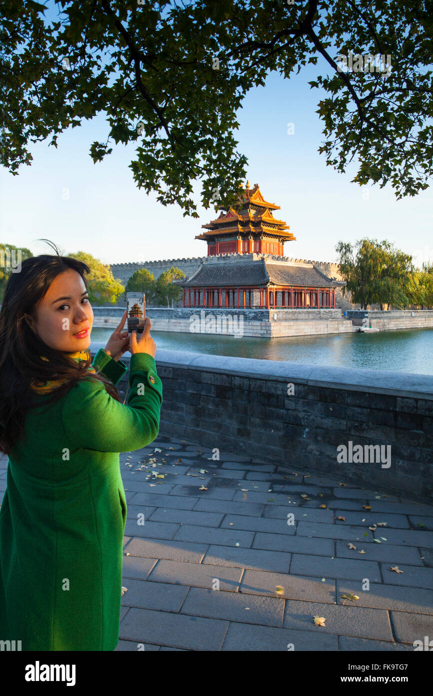 Chinese tourist photographs a Corner Tower and moat of the The ...
