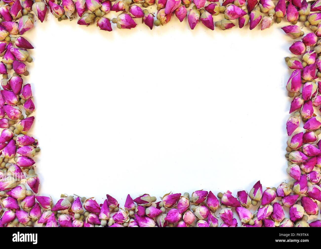 Border frame of romantic dried pink rose buds Stock Photo - Alamy