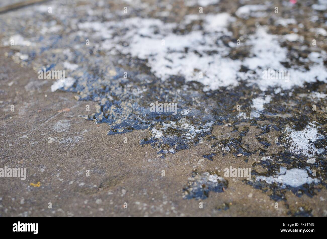 Black ice on sidewalk pavement after a snowfall in winter Stock Photo ...
