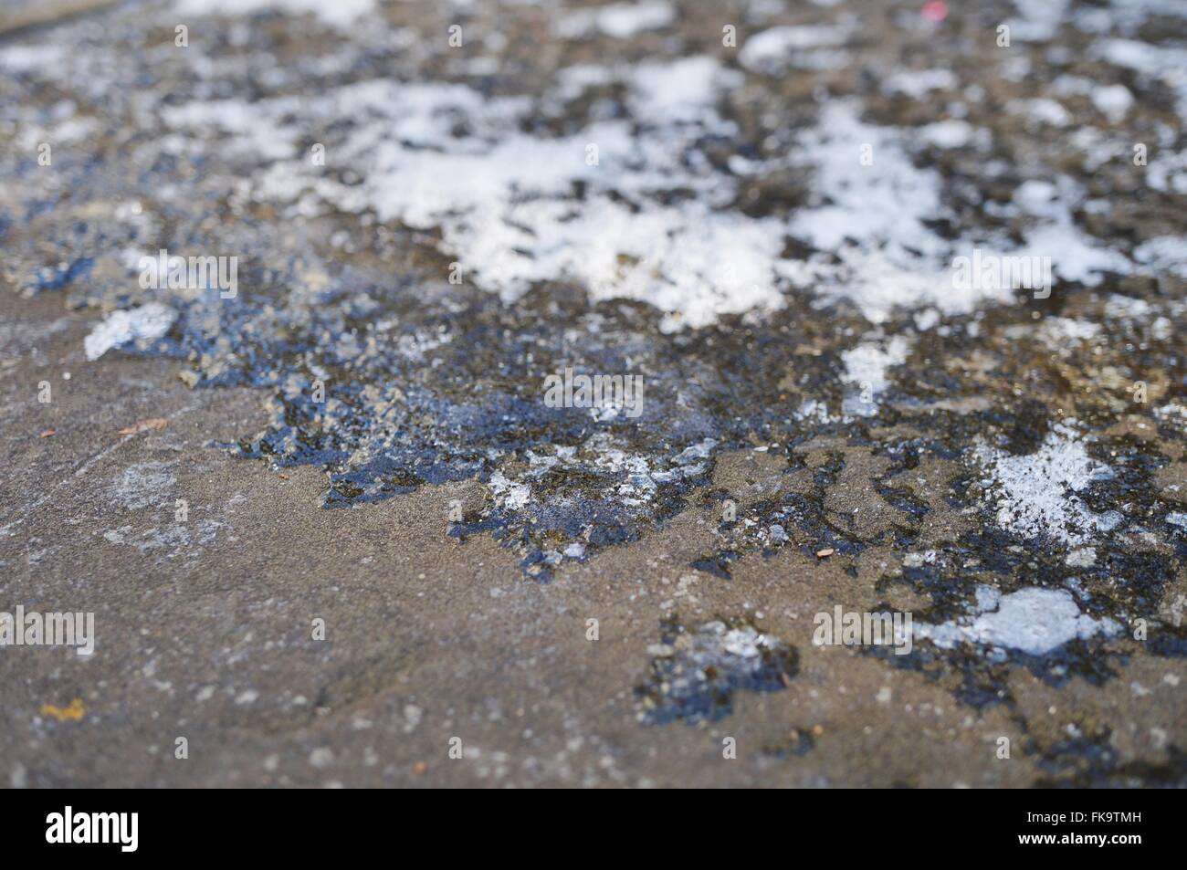 Black ice on sidewalk pavement after a snowfall in winter Stock Photo ...