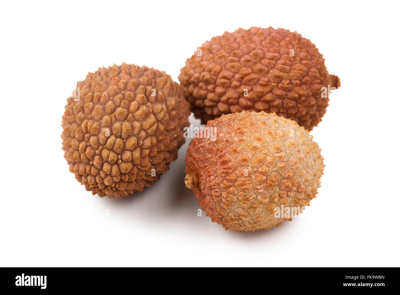 Three lychee fruits isolated on a white background Stock Photo - Alamy
