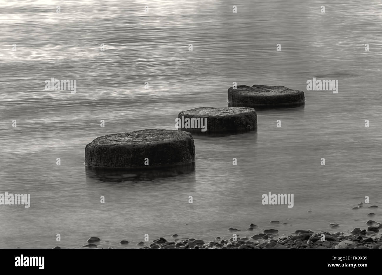 B&W of three objects in water Stock Photo - Alamy