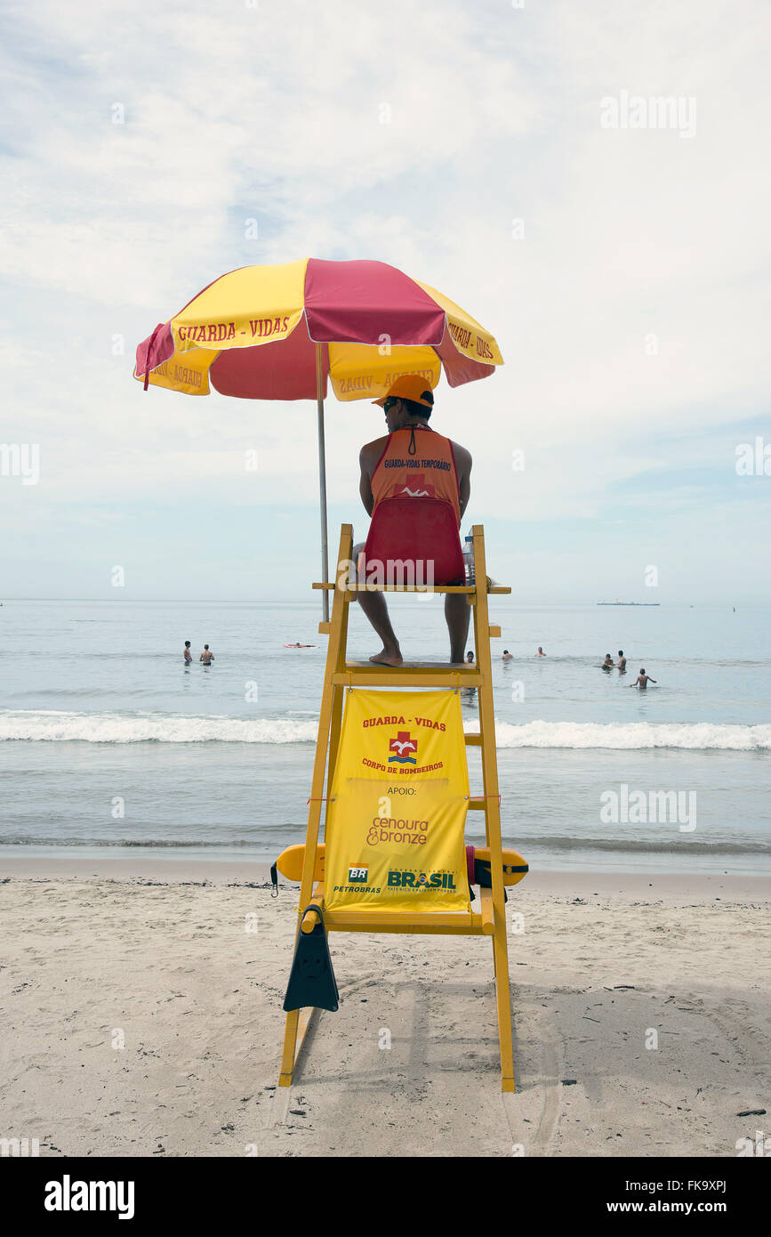 Lifeguard watching swimmers in Guaecá Beach Stock Photo - Alamy
